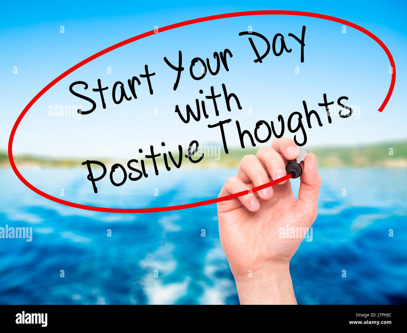 Man Hand writing Start your Dat with Positive Thoughts with black ...