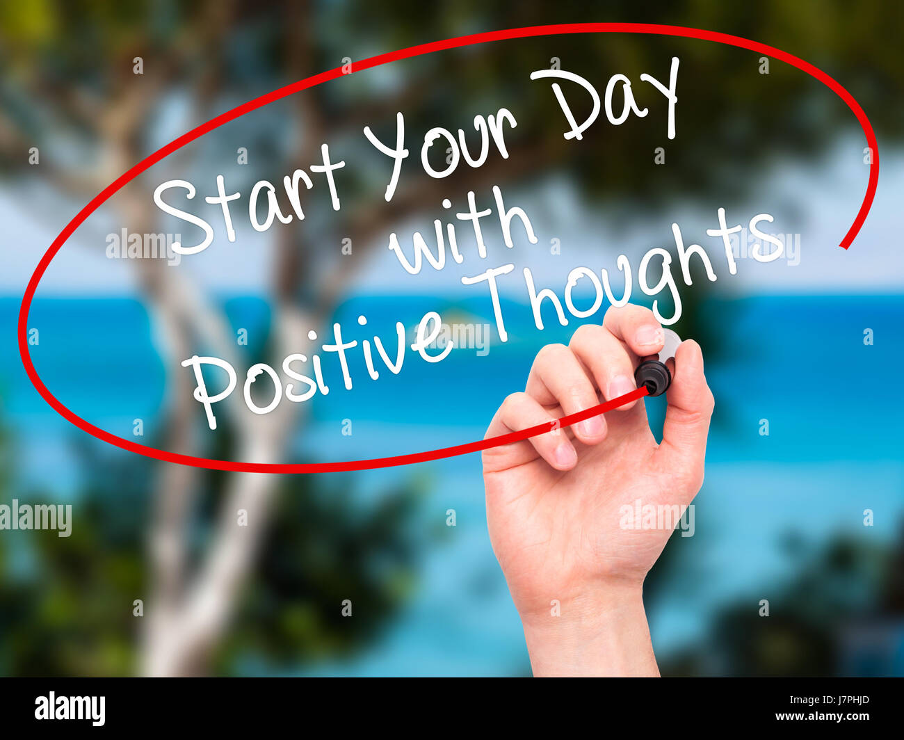 Man Hand writing Start your Dat with Positive Thoughts with black ...