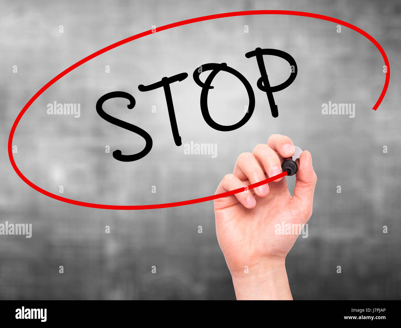 Man Hand writing STOP with black marker on visual screen. Isolated on ...