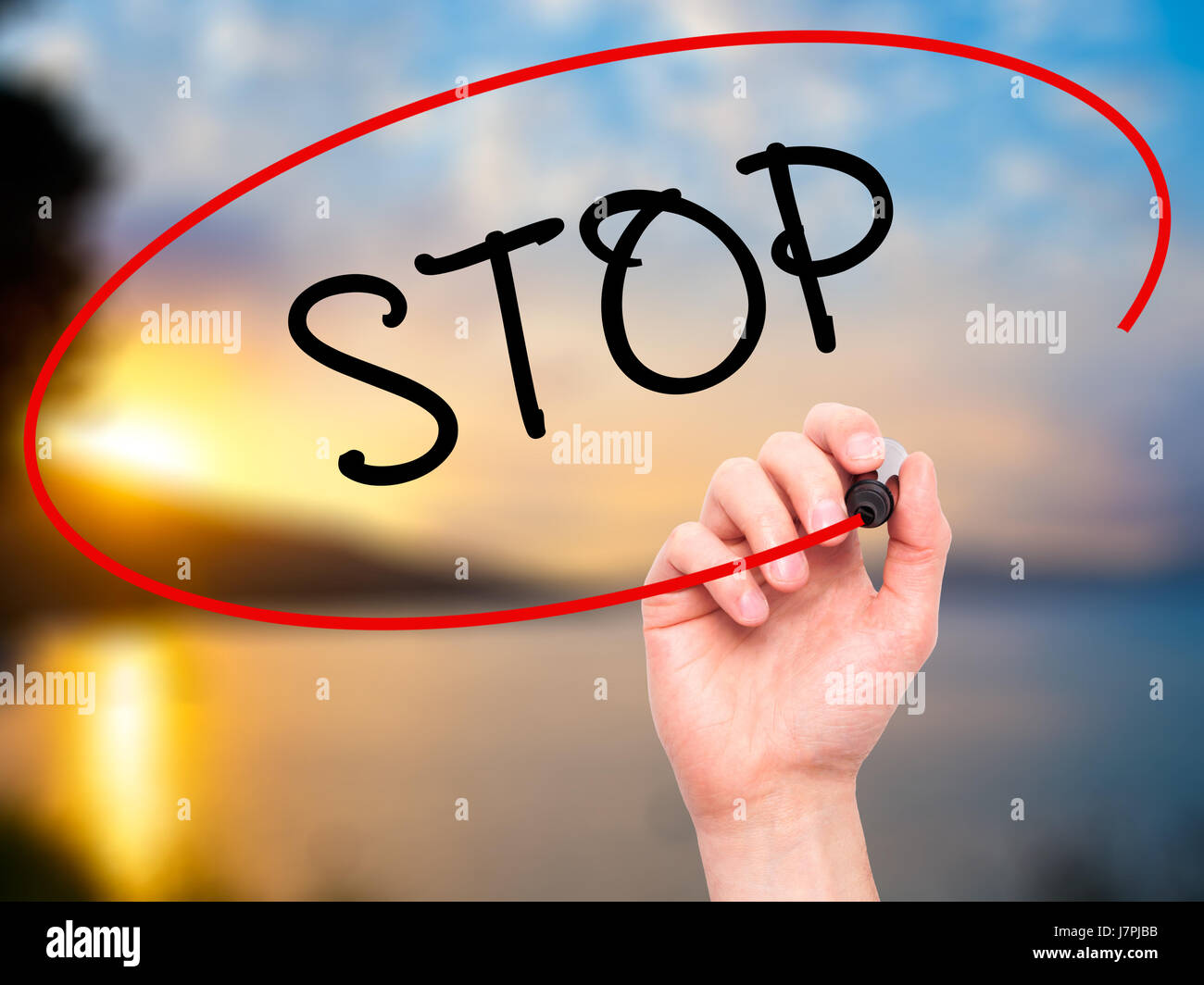 Man Hand writing STOP with black marker on visual screen. Isolated on ...