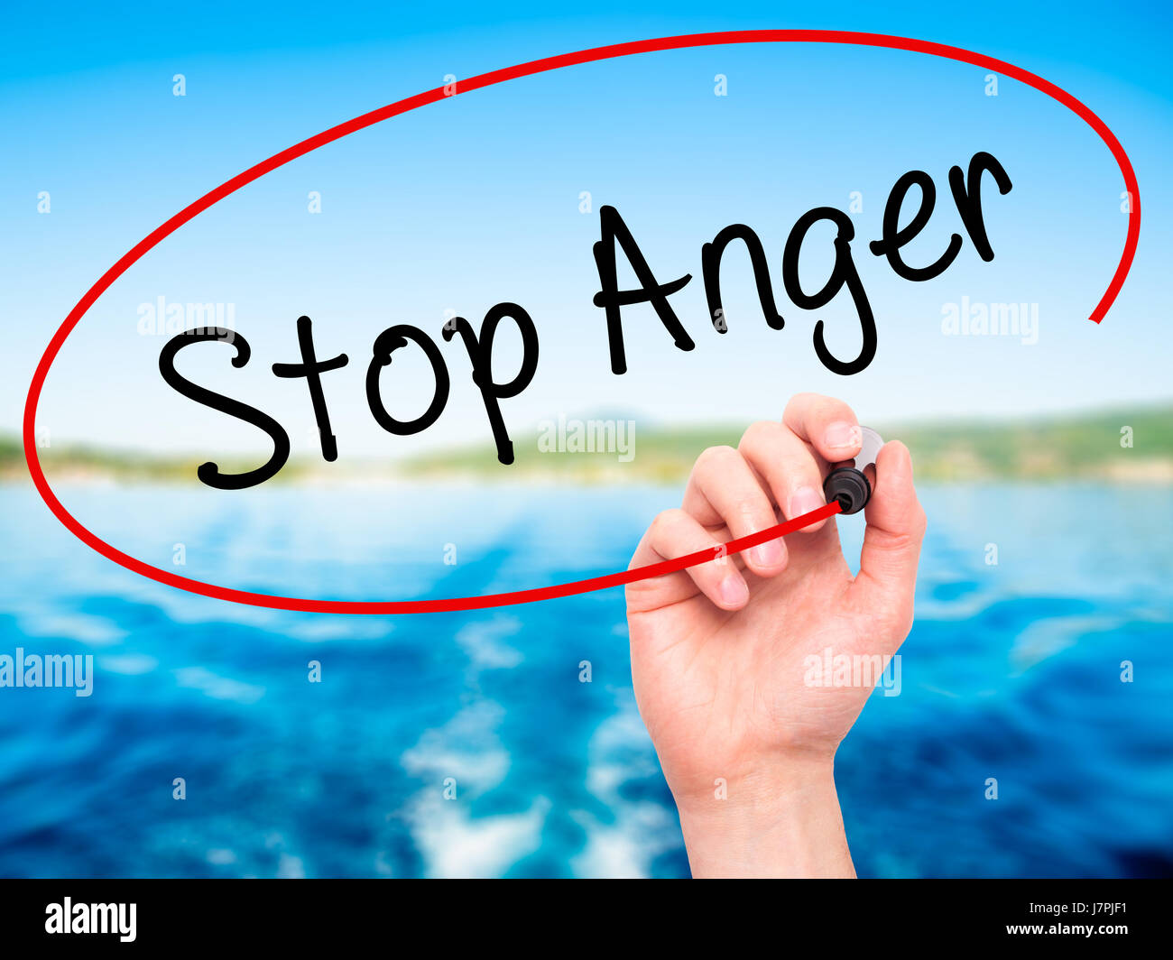 Man Hand writing Stop Anger with black marker on visual screen ...