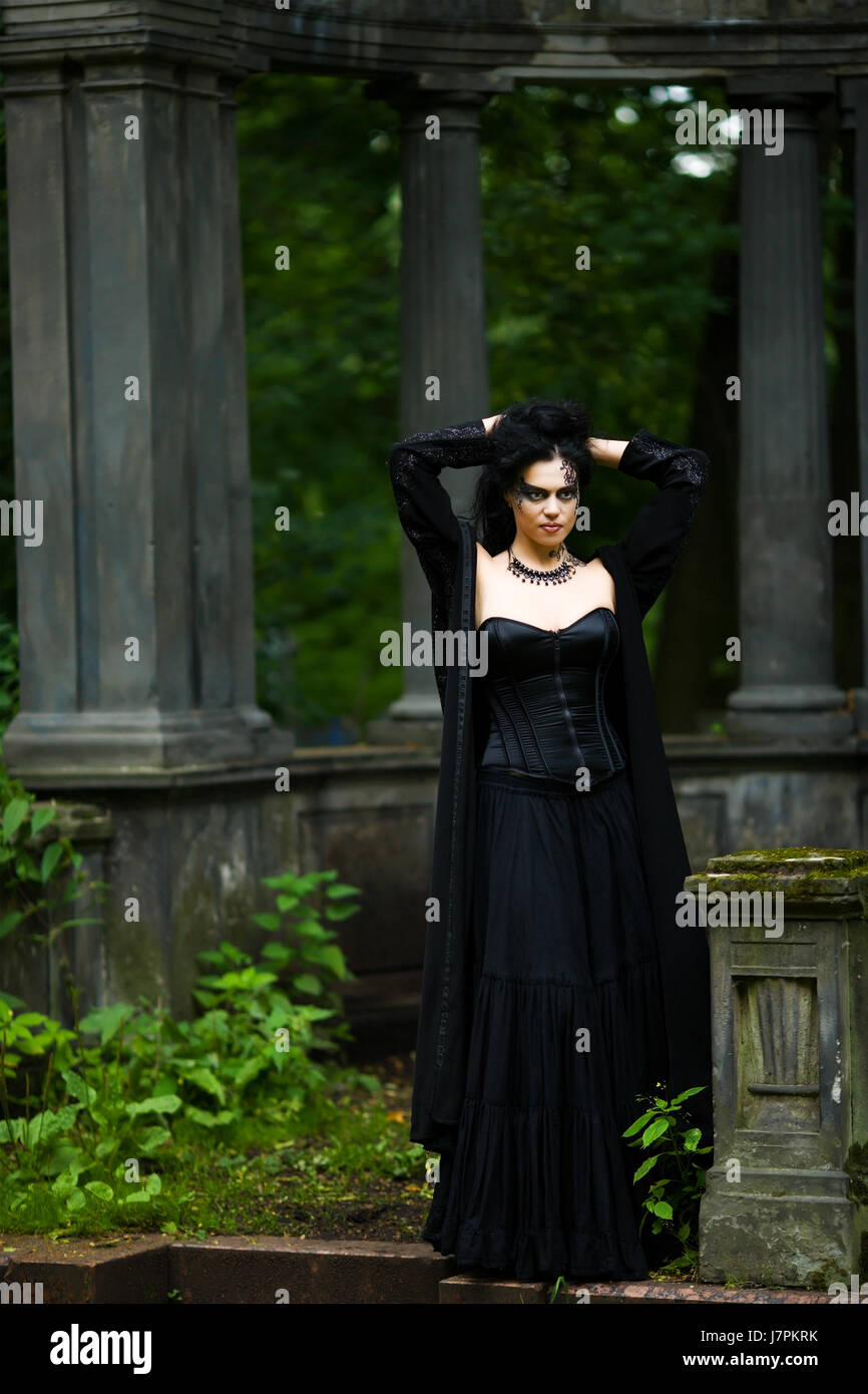 Young beautiful demonic female creature walking through the night Stock ...