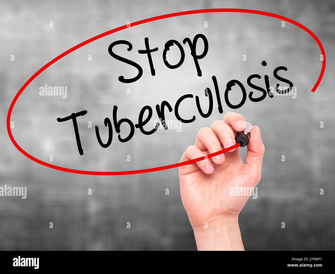 Man Hand writing Stop Tuberculosis with black marker on visual screen ...