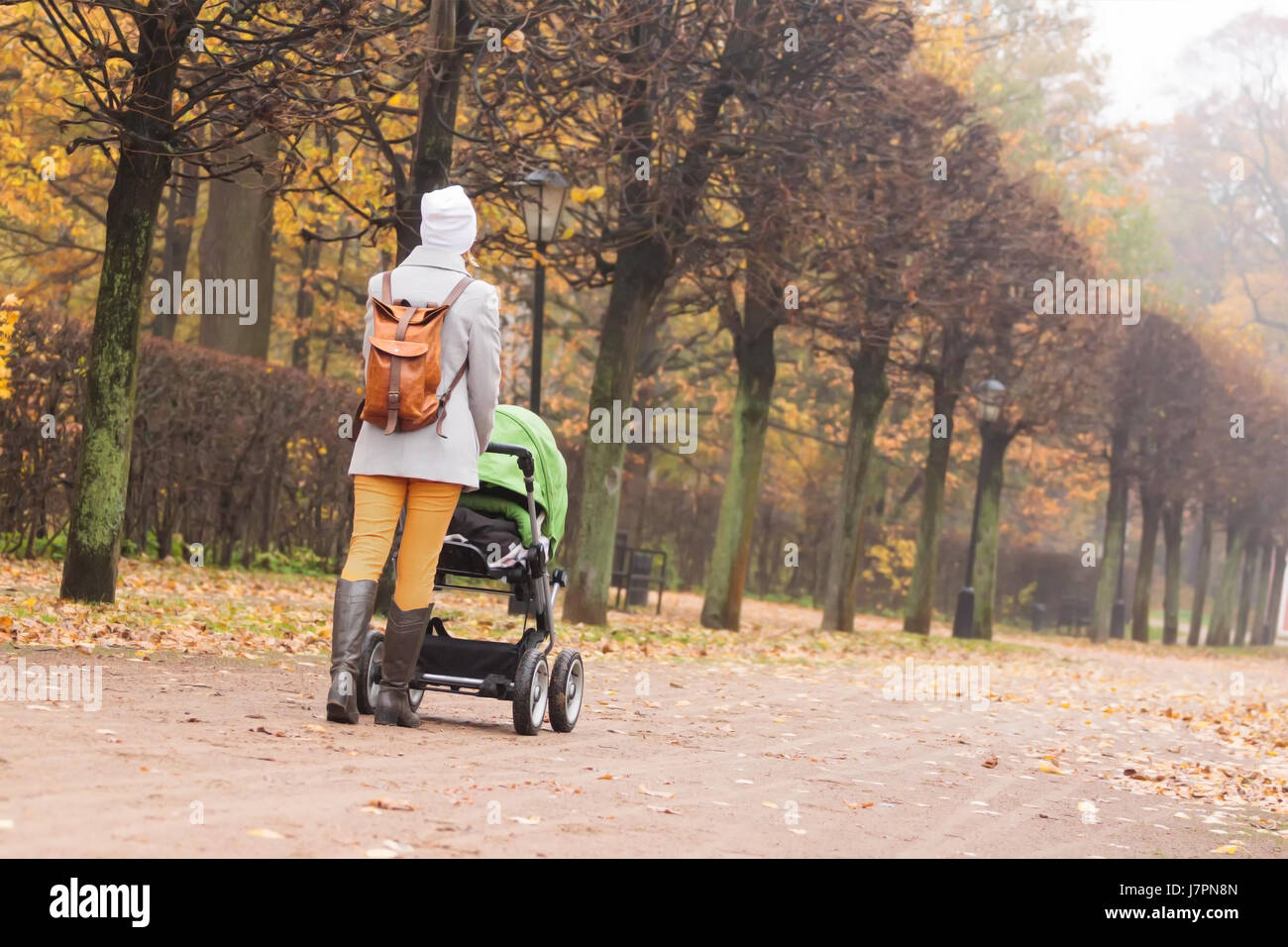 Woman walking stroller in park hi-res stock photography and images - Alamy