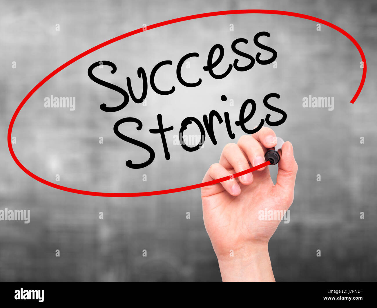 Man Hand writing Success Stories with black marker on visual screen ...