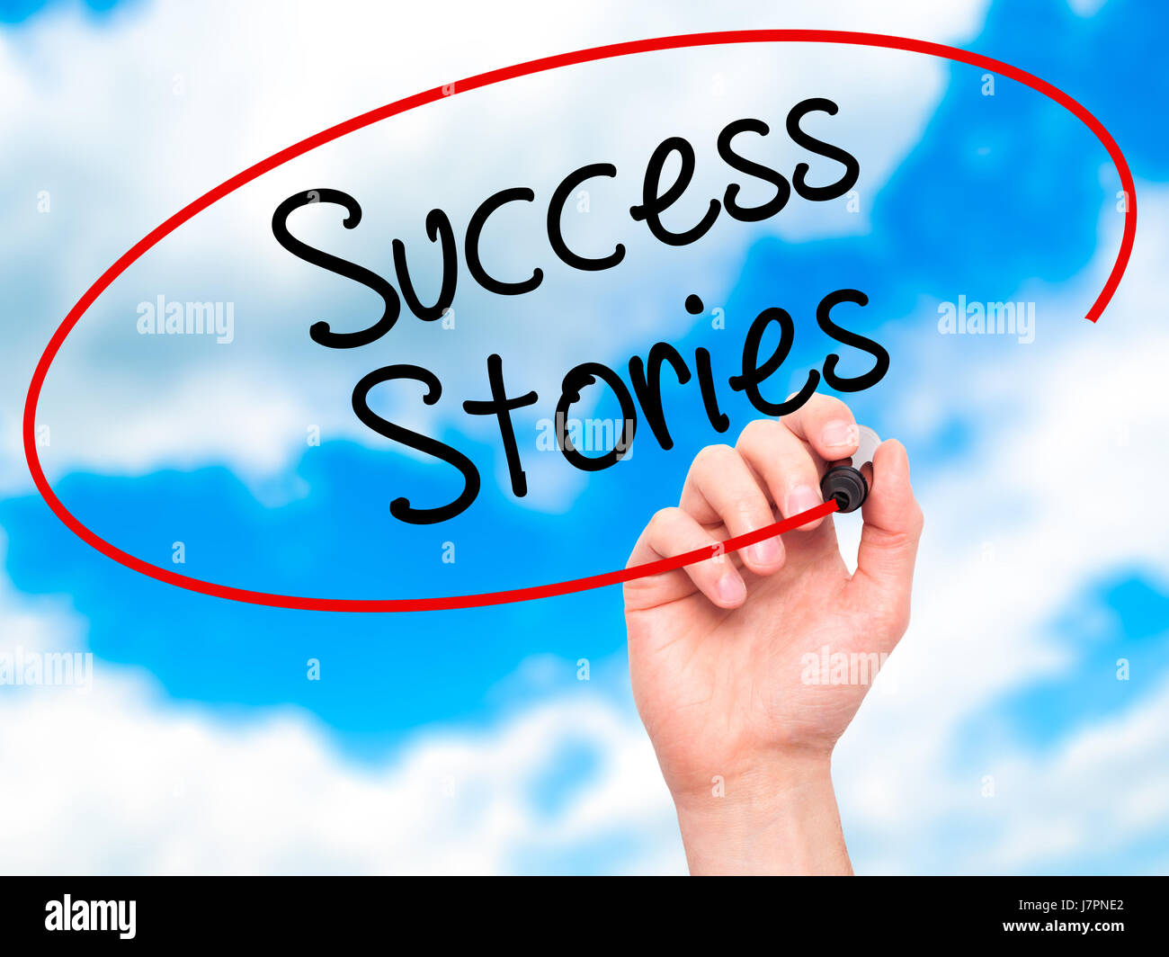 Man Hand writing Success Stories with black marker on visual screen ...