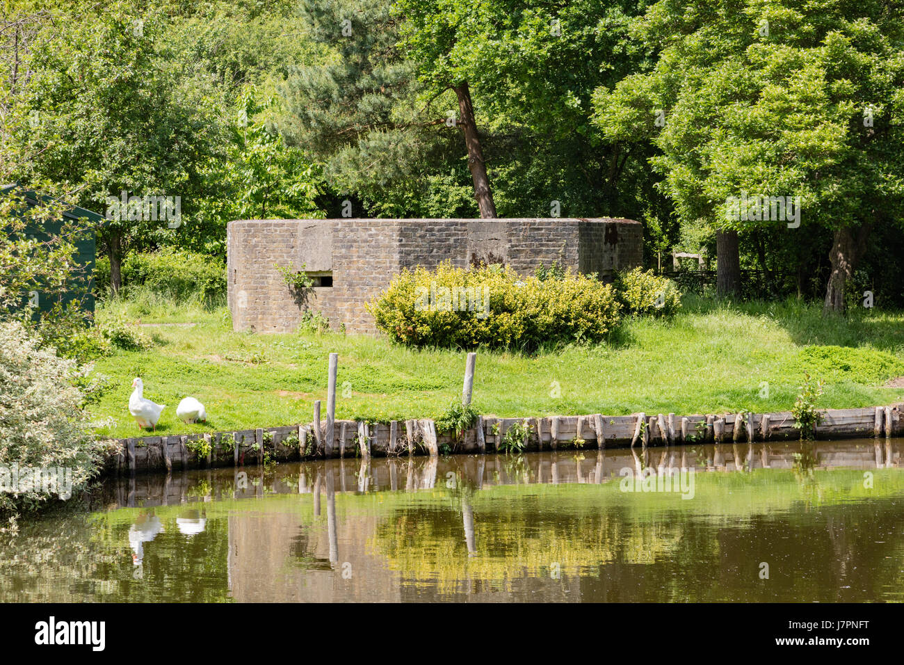 A World War Two pill box sits on the banks of the River Medway opposite ...