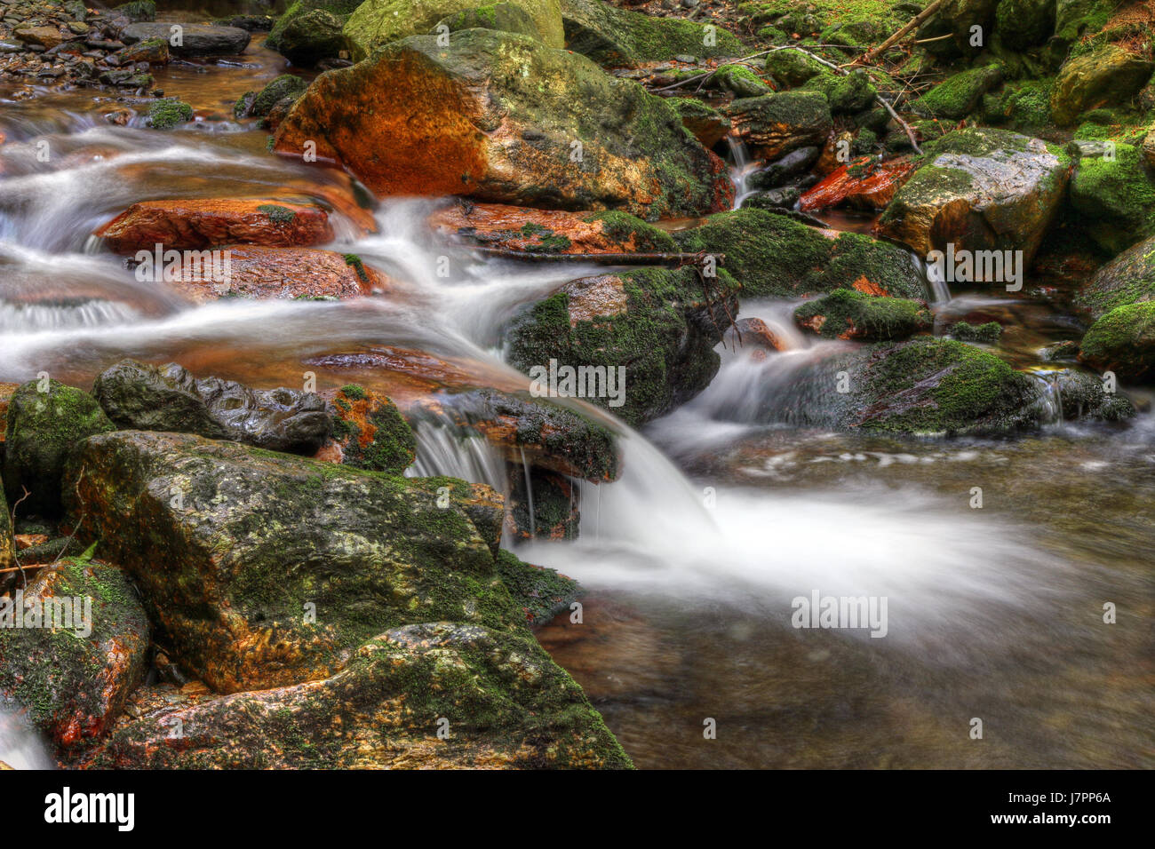 Abstract detail of the water flowing over rocks Stock Photo - Alamy