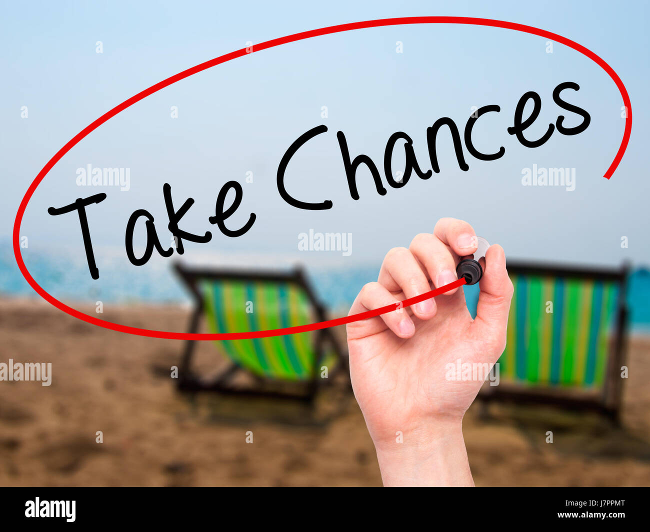 Man Hand writing Take Chances with black marker on visual screen ...