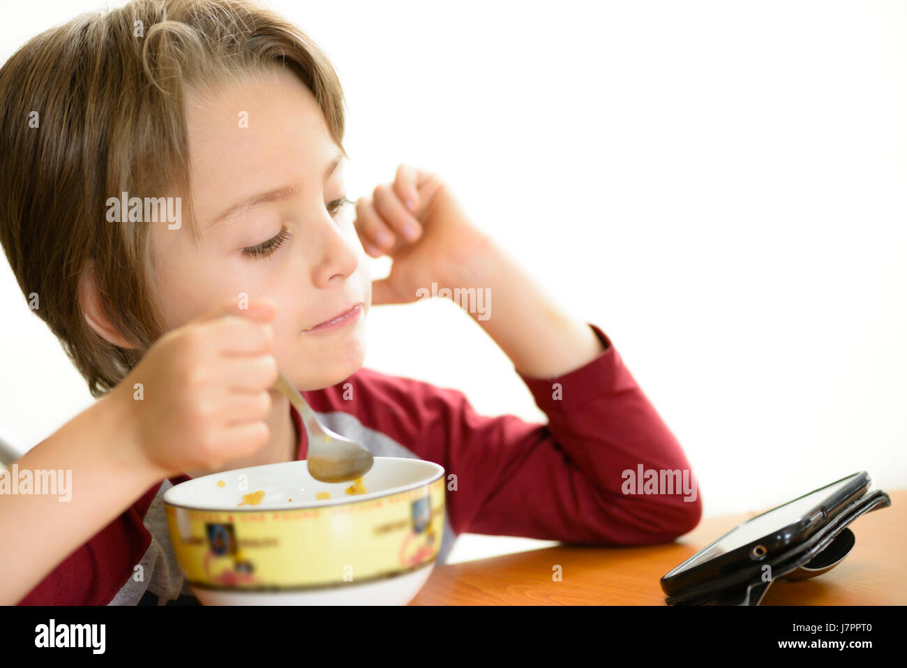 Child tablet table eating hi-res stock photography and images - Alamy