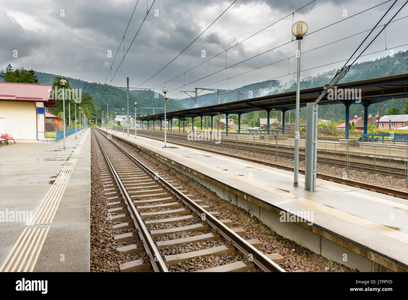 Rural train station, rainy day Stock Photo - Alamy