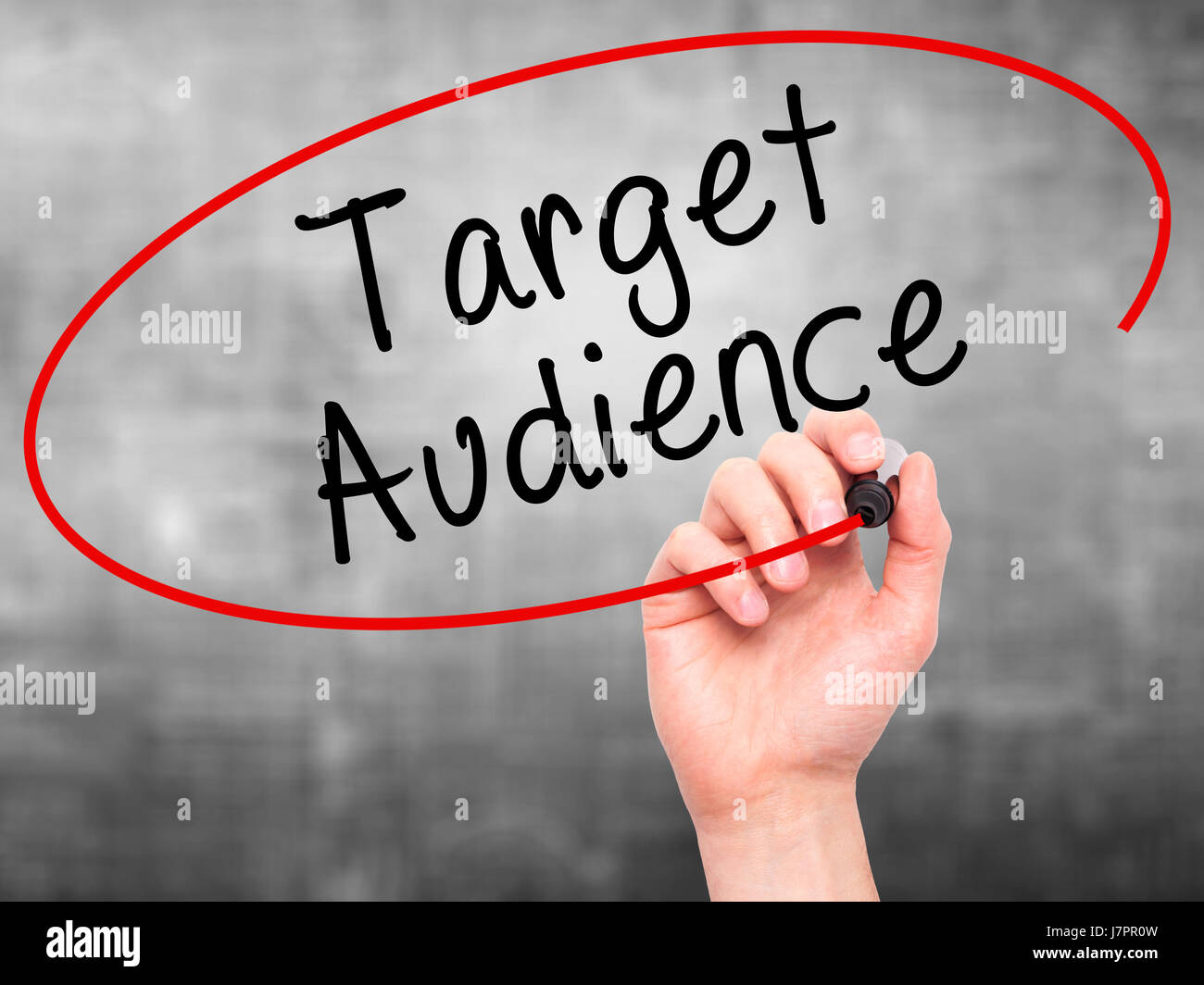 Man Hand writing Target Audience with black marker on visual screen ...