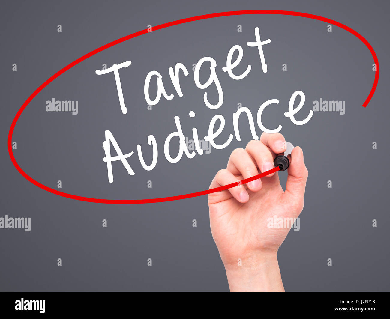 Man Hand writing Target Audience with black marker on visual screen ...
