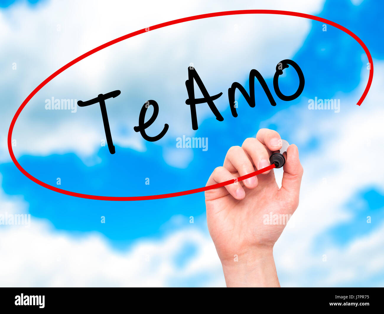 Man Hand writing Te Amo ( I Love You In Spanish) with black marker on ...