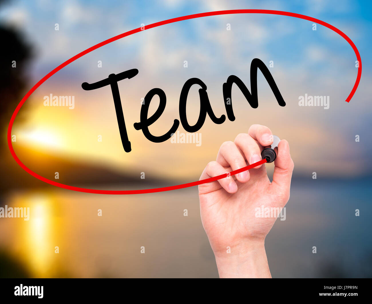 Man Hand writing Team with black marker on visual screen. Isolated on ...