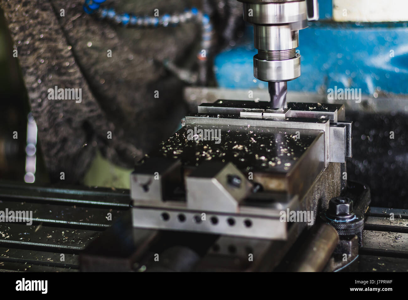 active milling machine during processing part of engine industry ...