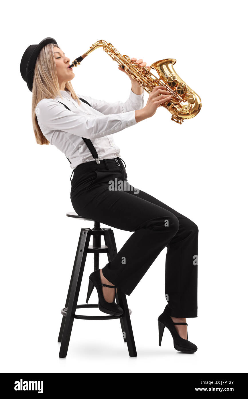 Woman sitting on a chair and playing a saxophone isolated on white ...