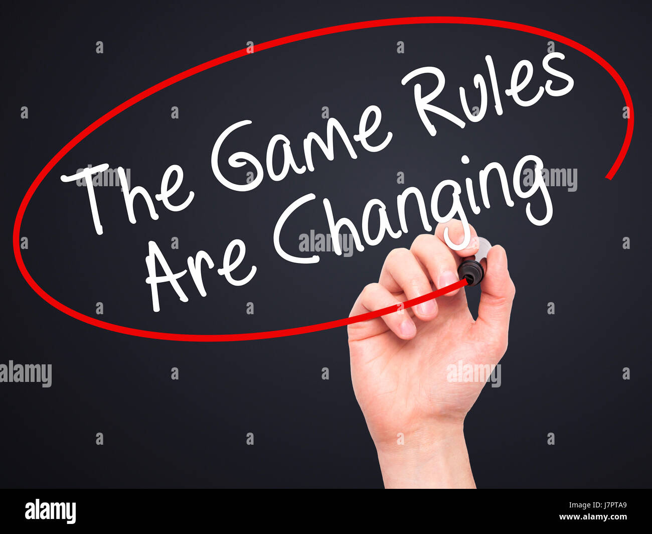 Man Hand writing The Game Rules Are Changing with black marker on ...