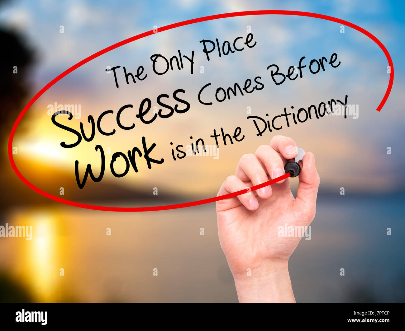 Man Hand writing The Only Place Success Comes Before Work is in the ...