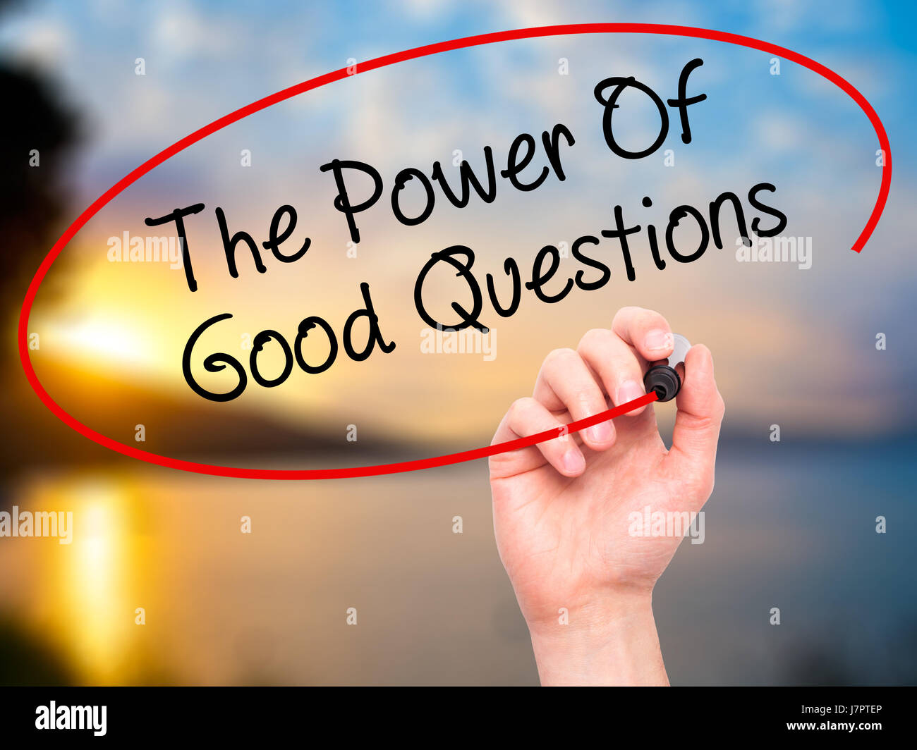 Man Hand writing The Power Of Good Questions with black marker on ...