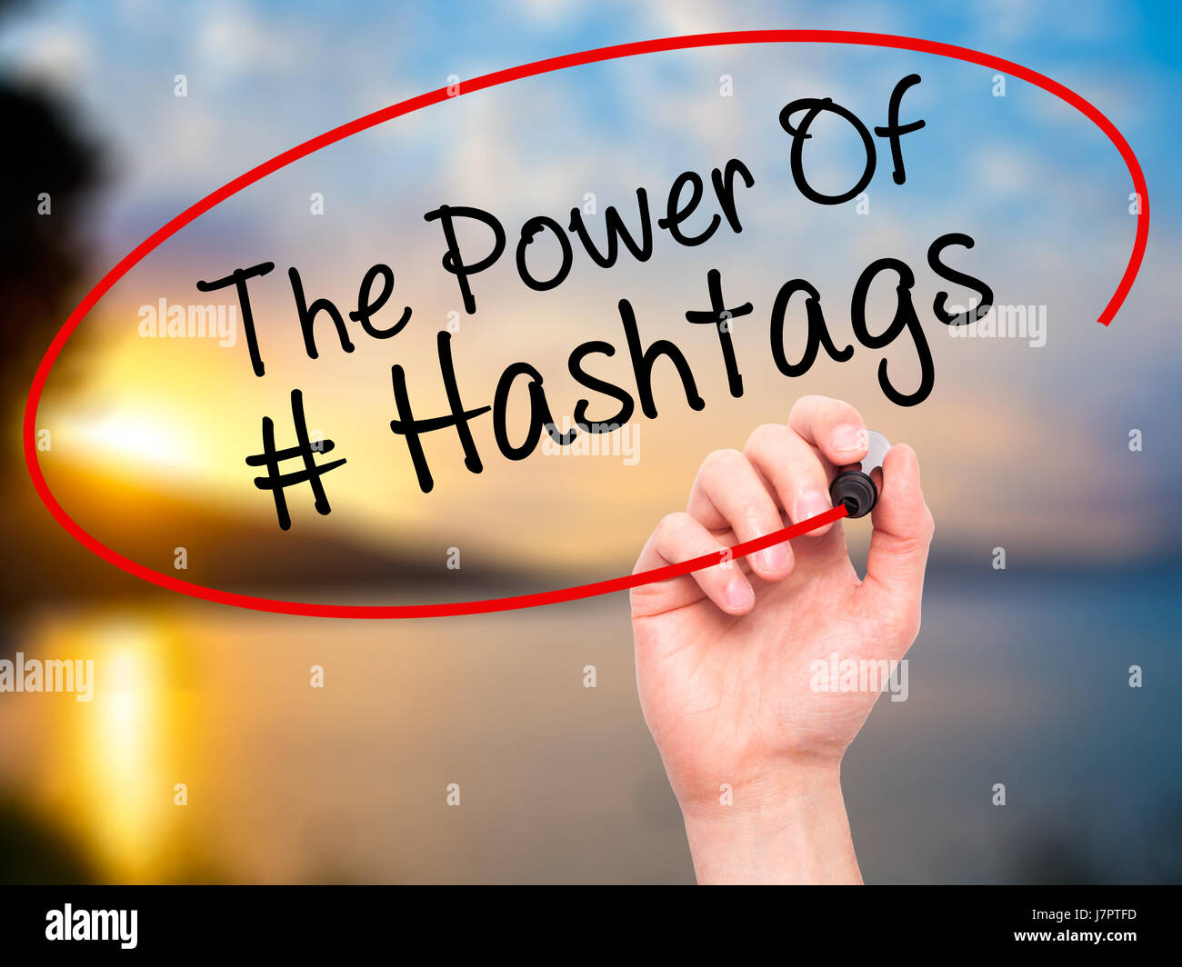 Man Hand writing The Power of Hashtags with black marker on visual ...