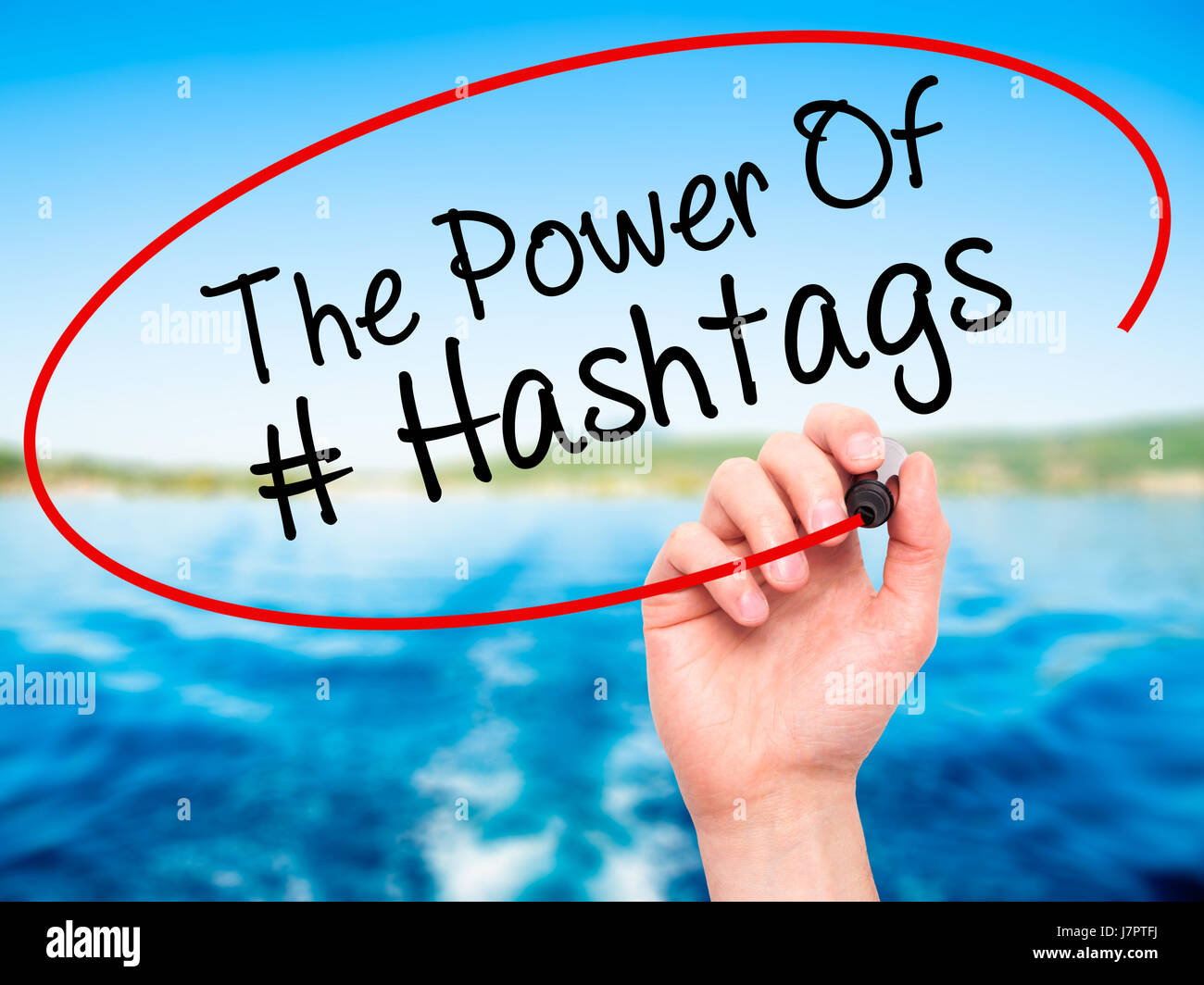 Man Hand writing The Power of Hashtags with black marker on visual ...