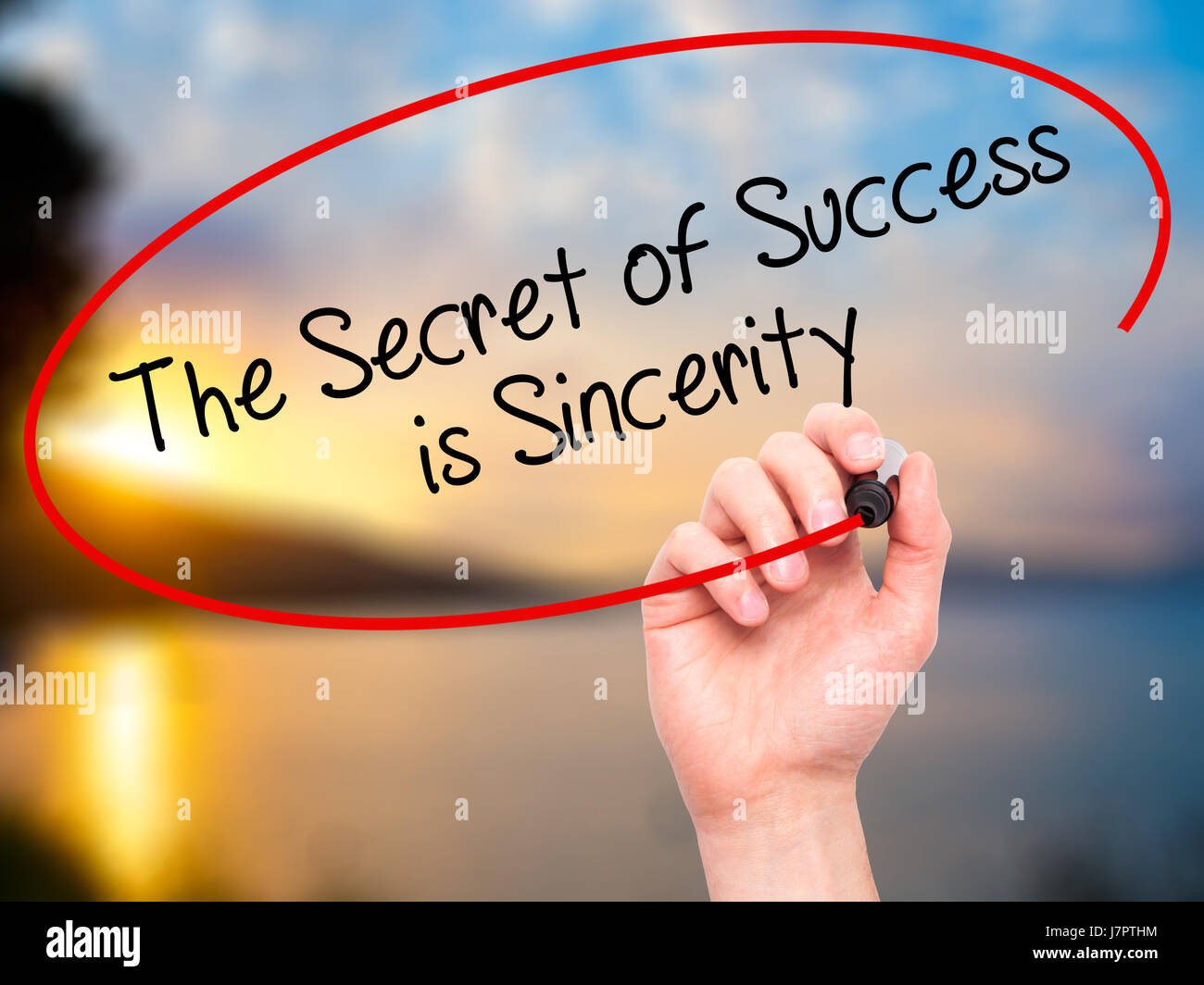 Man Hand writing The Secret of Success is Sincerity with black marker ...
