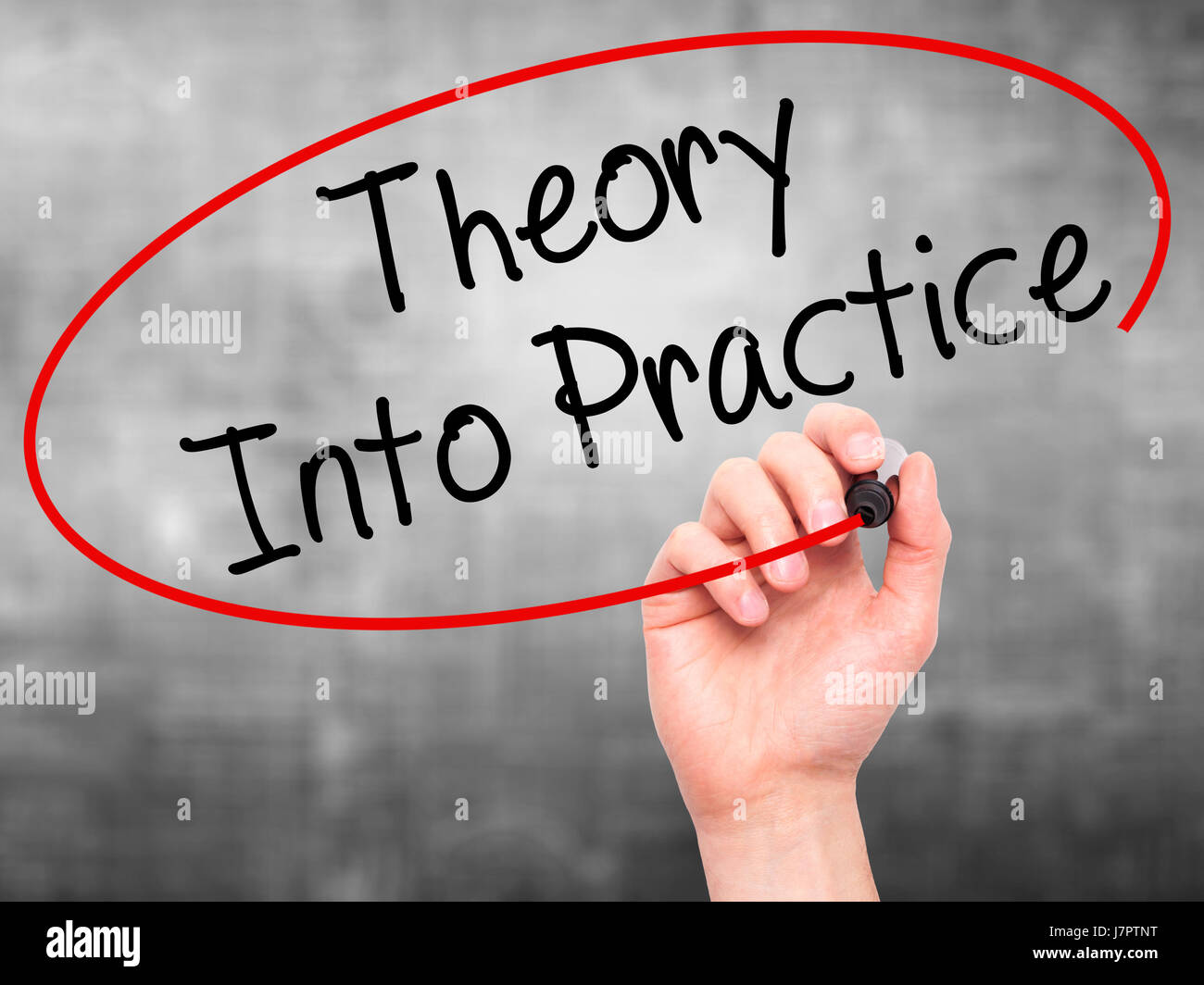 Man Hand writing Theory Into Practice with black marker on visual ...