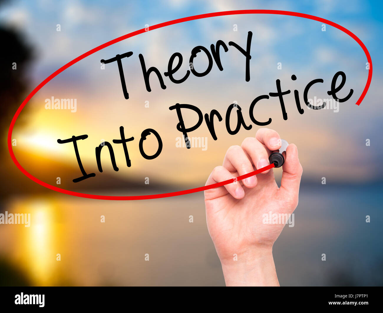 Man Hand writing Theory Into Practice with black marker on visual ...