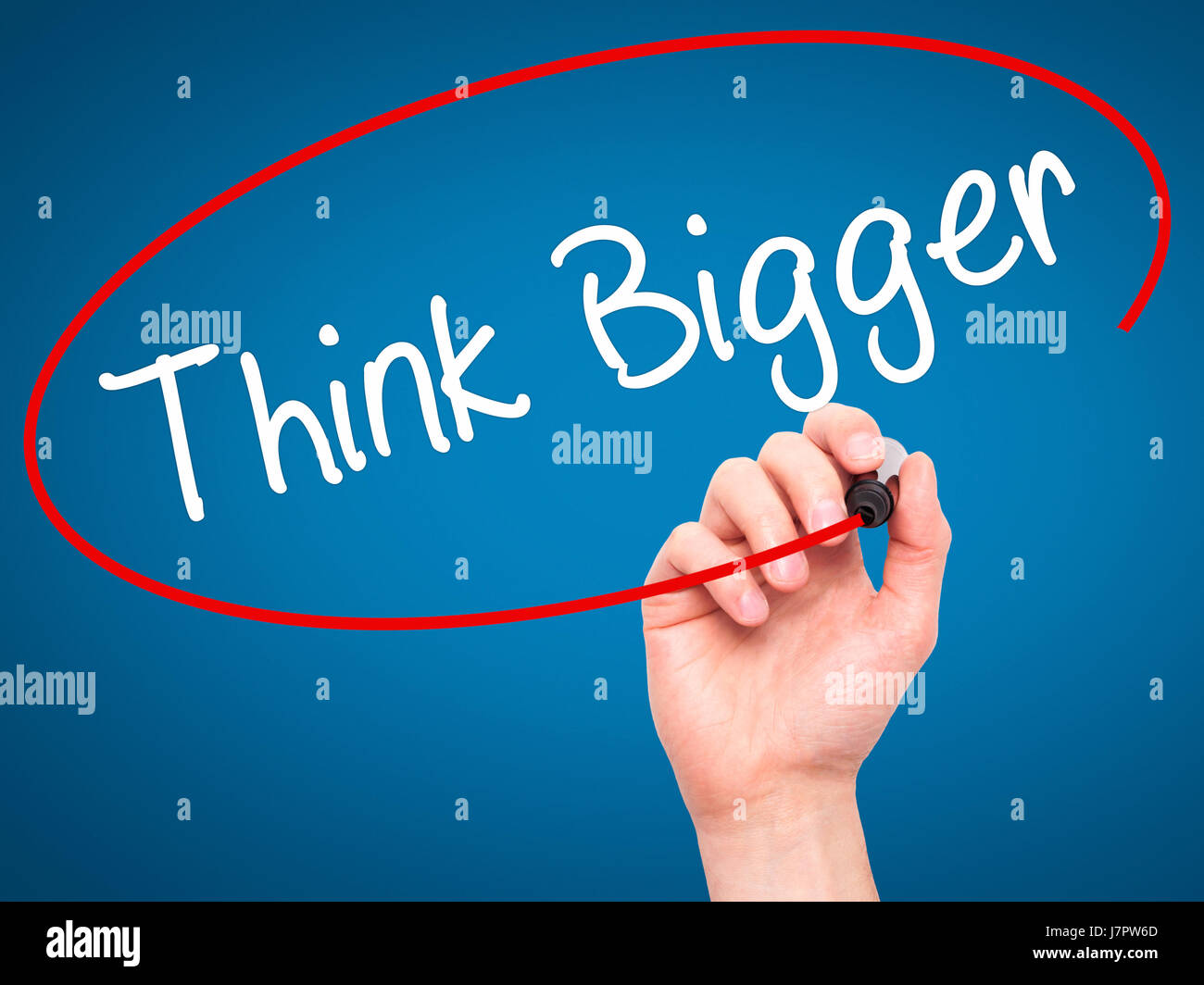 Man Hand writing Think Bigger with black marker on visual screen ...