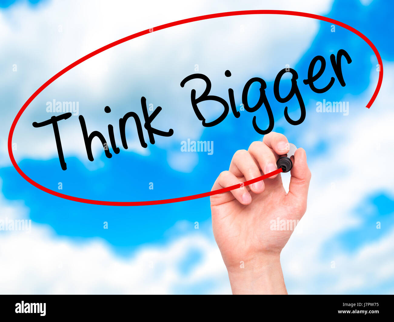 Man Hand writing Think Bigger with black marker on visual screen ...