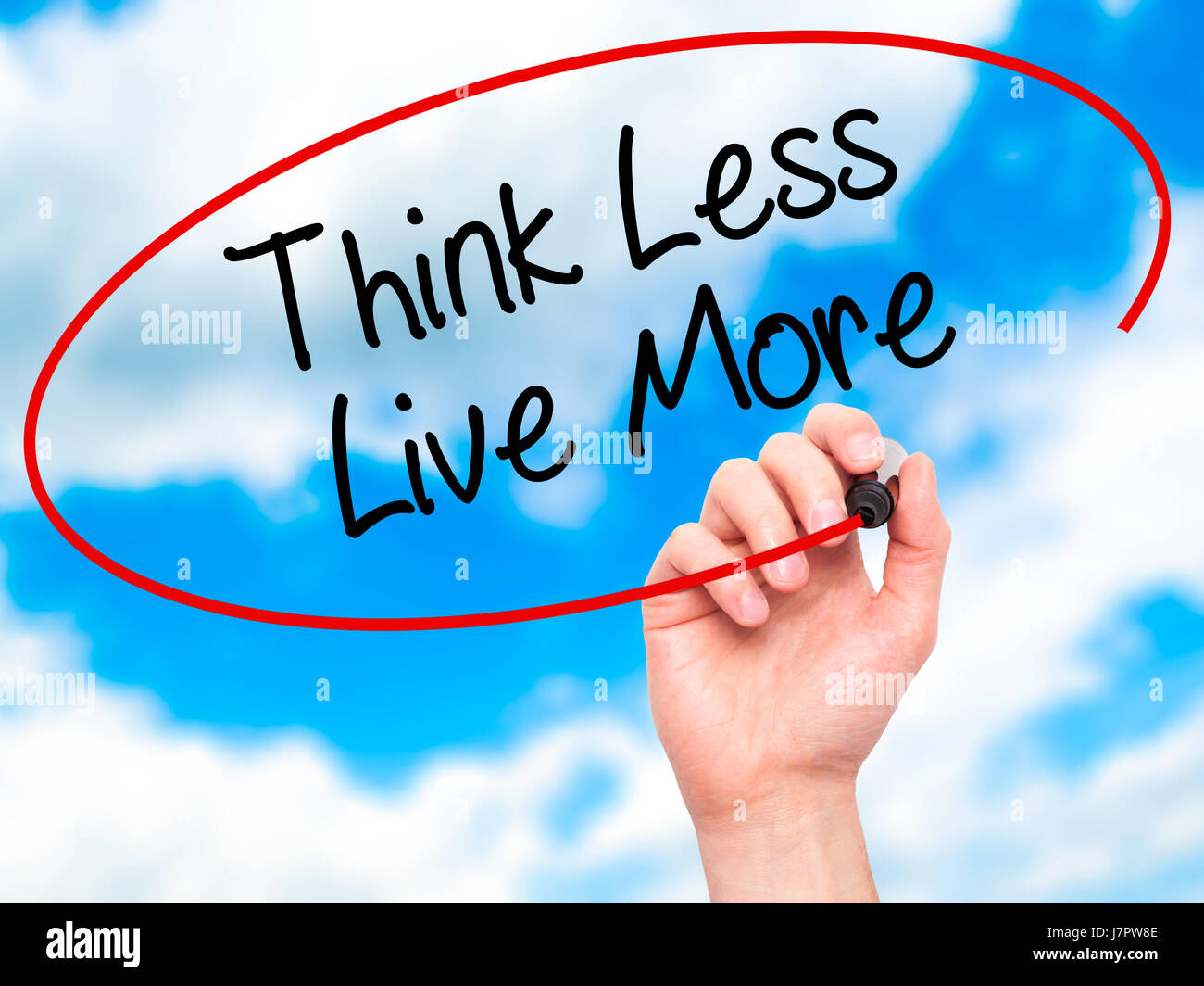 Man Hand writing Think Less Live More with black marker on visual ...