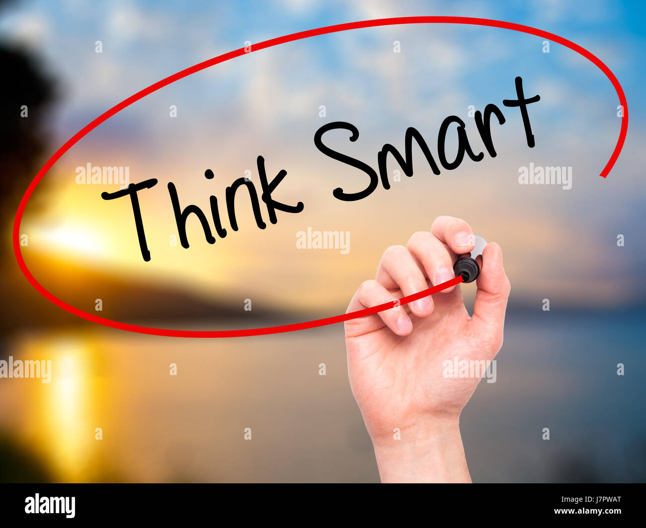 Man Hand writing Think Smart with black marker on visual screen ...