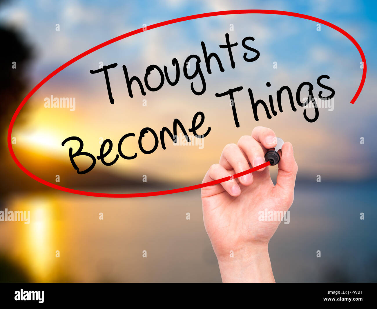 Man Hand writing Thoughts Become Things with black marker on visual ...