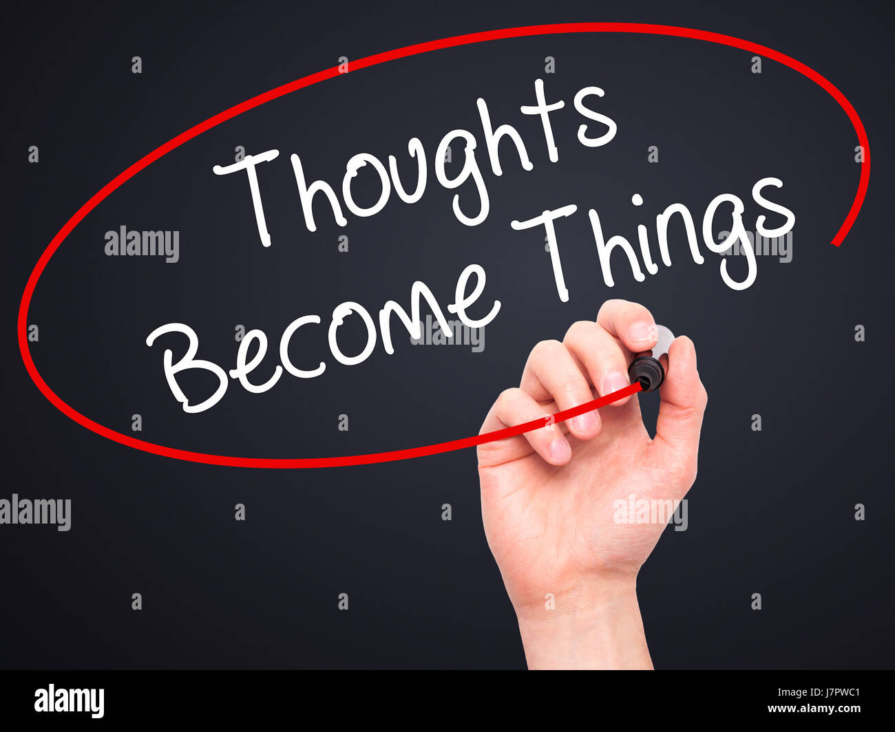 Man Hand writing Thoughts Become Things with black marker on visual ...