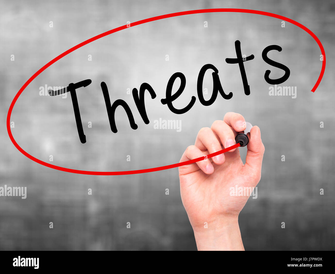 Man Hand writing Threats with black marker on visual screen. Isolated ...