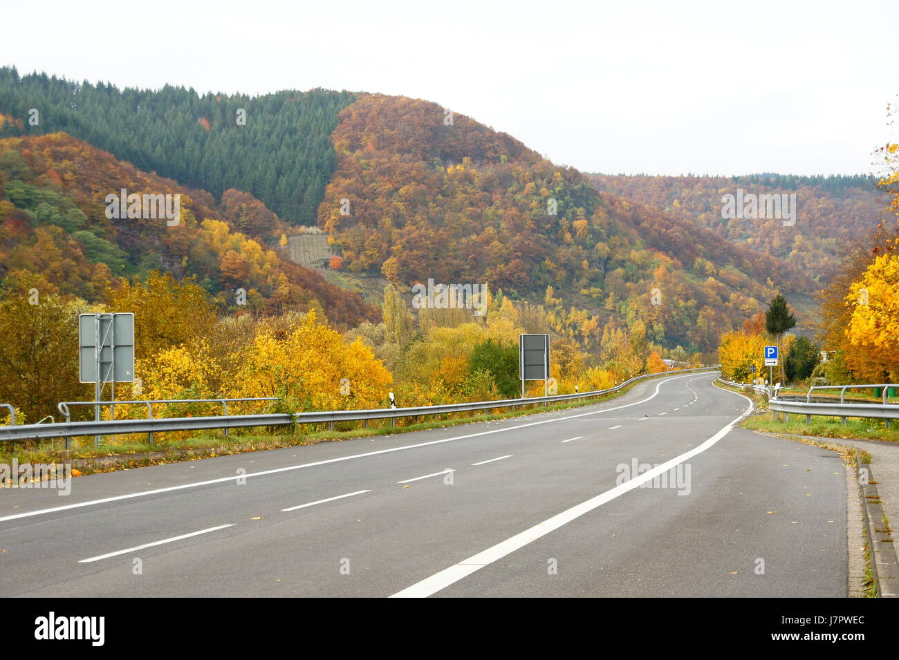 through road street road empty emptiness void bus stop crash barrier ...
