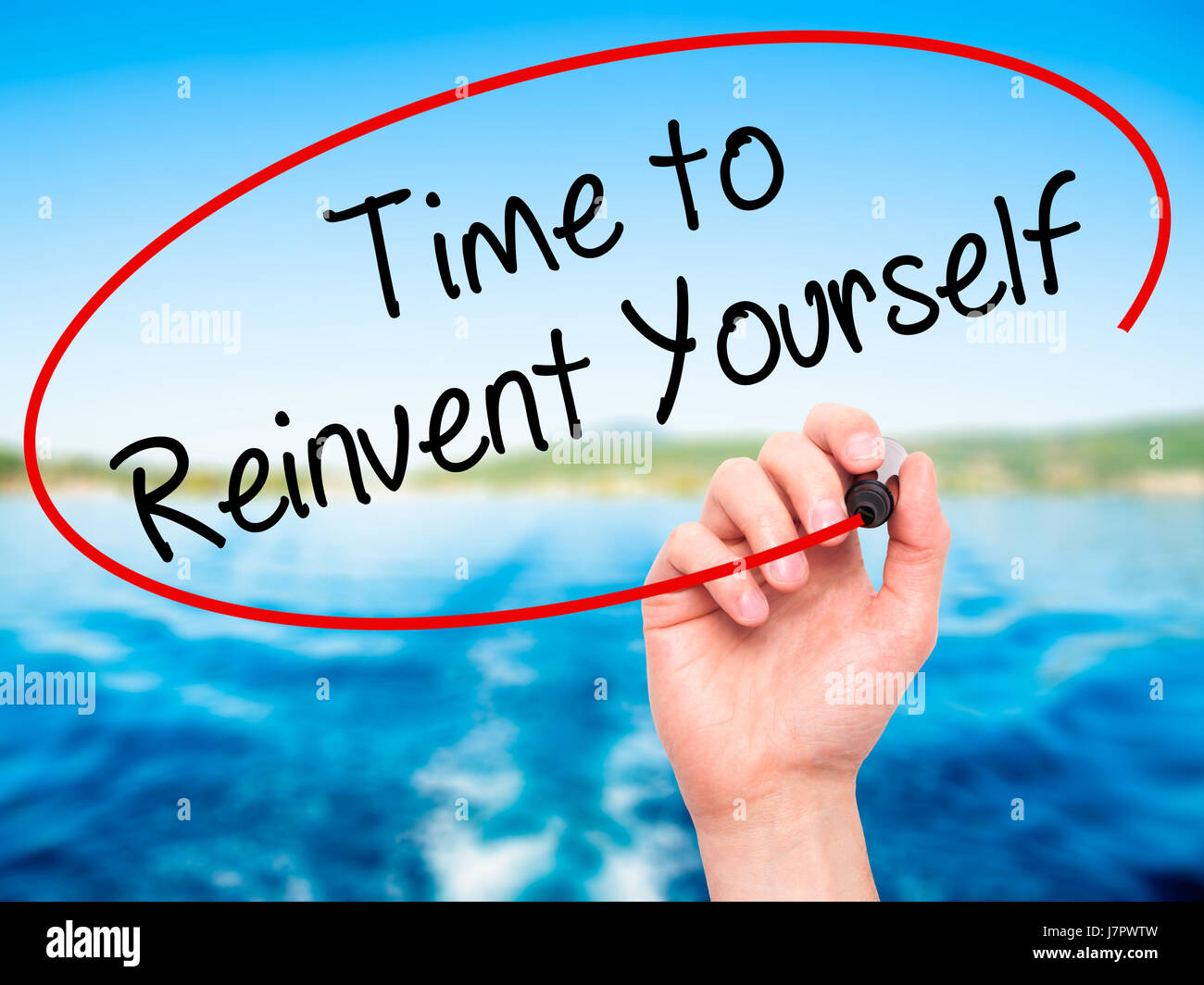 Man Hand writing Time to Reinvent Yourself with black marker on visual ...