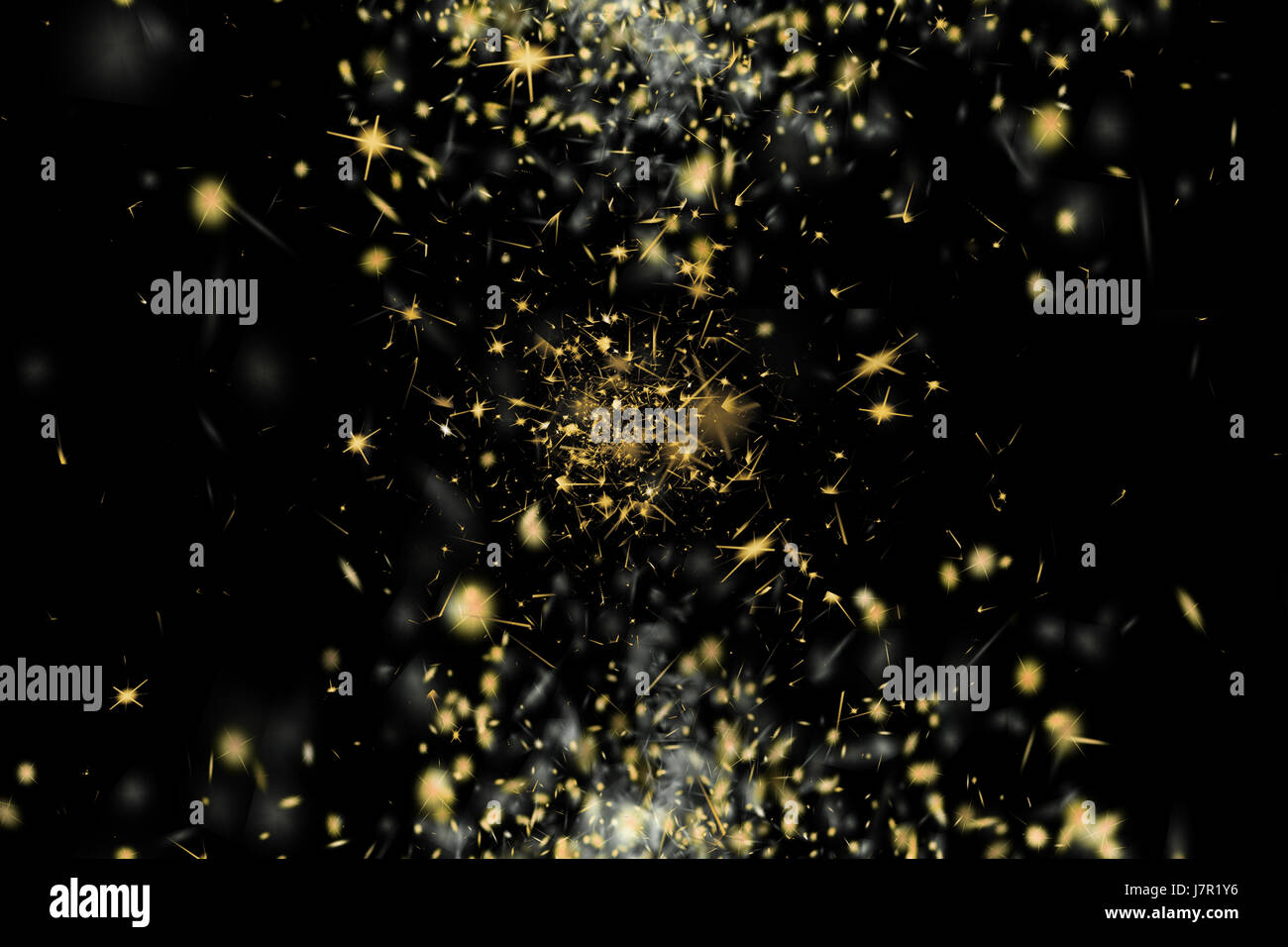 Freeze motion of shiny yellow golden particles exploding, isolated on black dark background ...