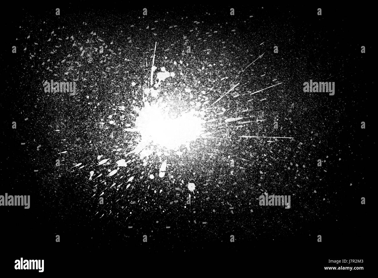Freeze motion of white powder exploding, isolated on black, dark ...