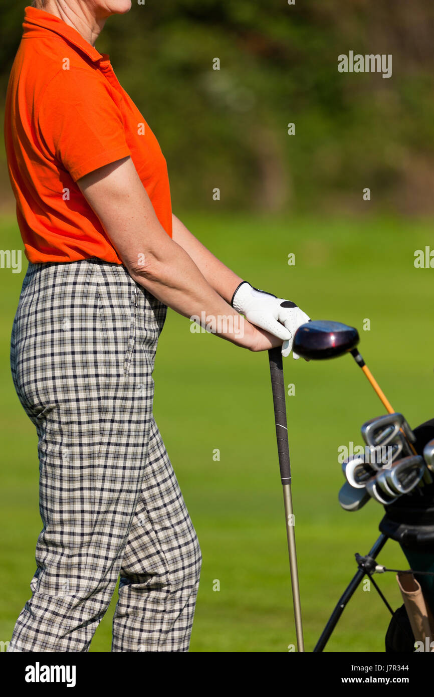 Older woman playing golf hi-res stock photography and images - Alamy