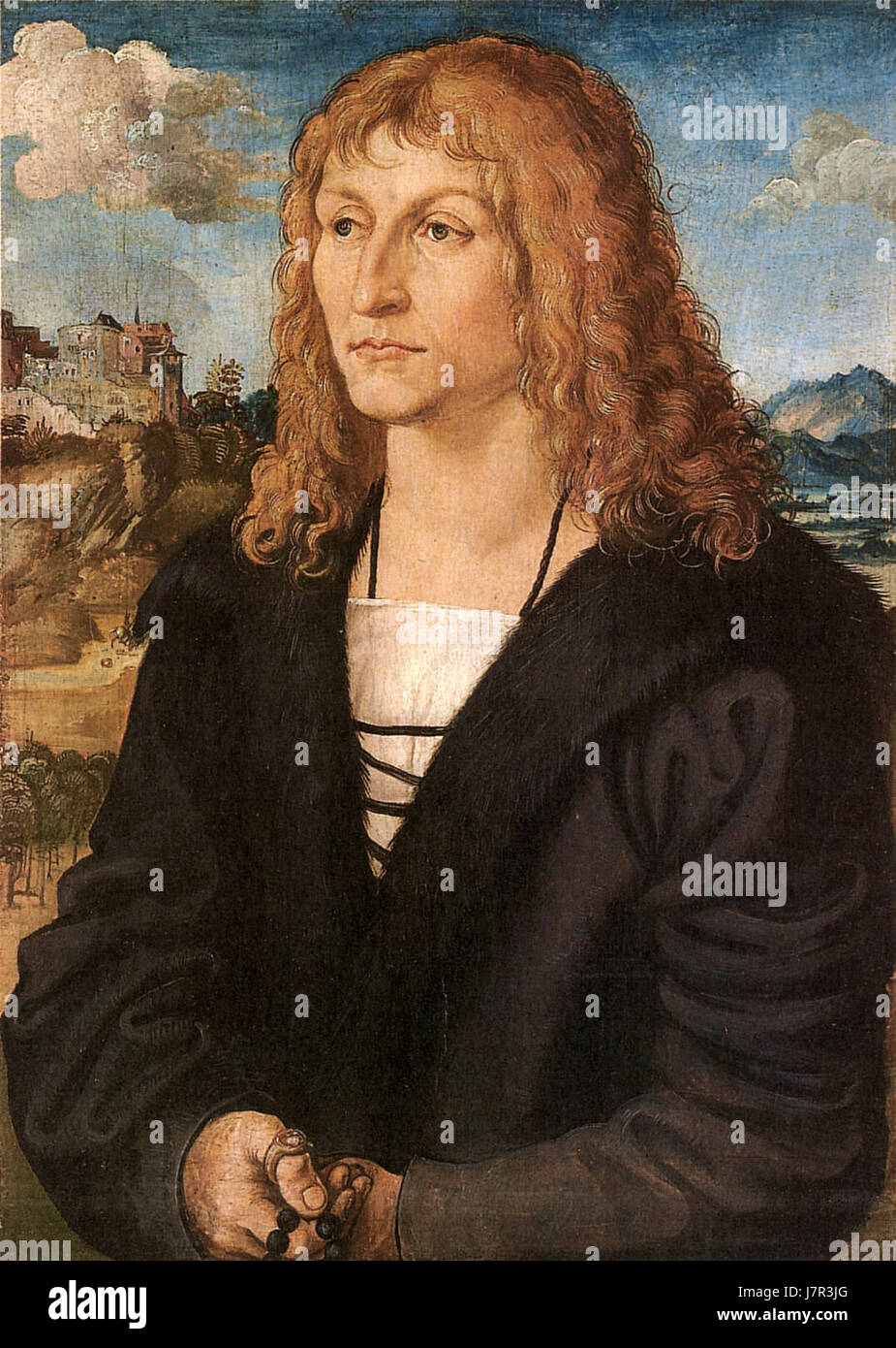 The image shows a young man without a beard, characterized by a clean ...