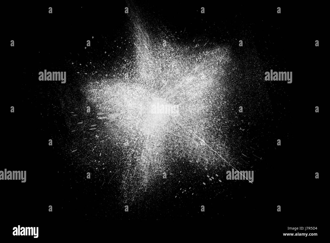 Freeze motion of white powder exploding, isolated on black, dark ...