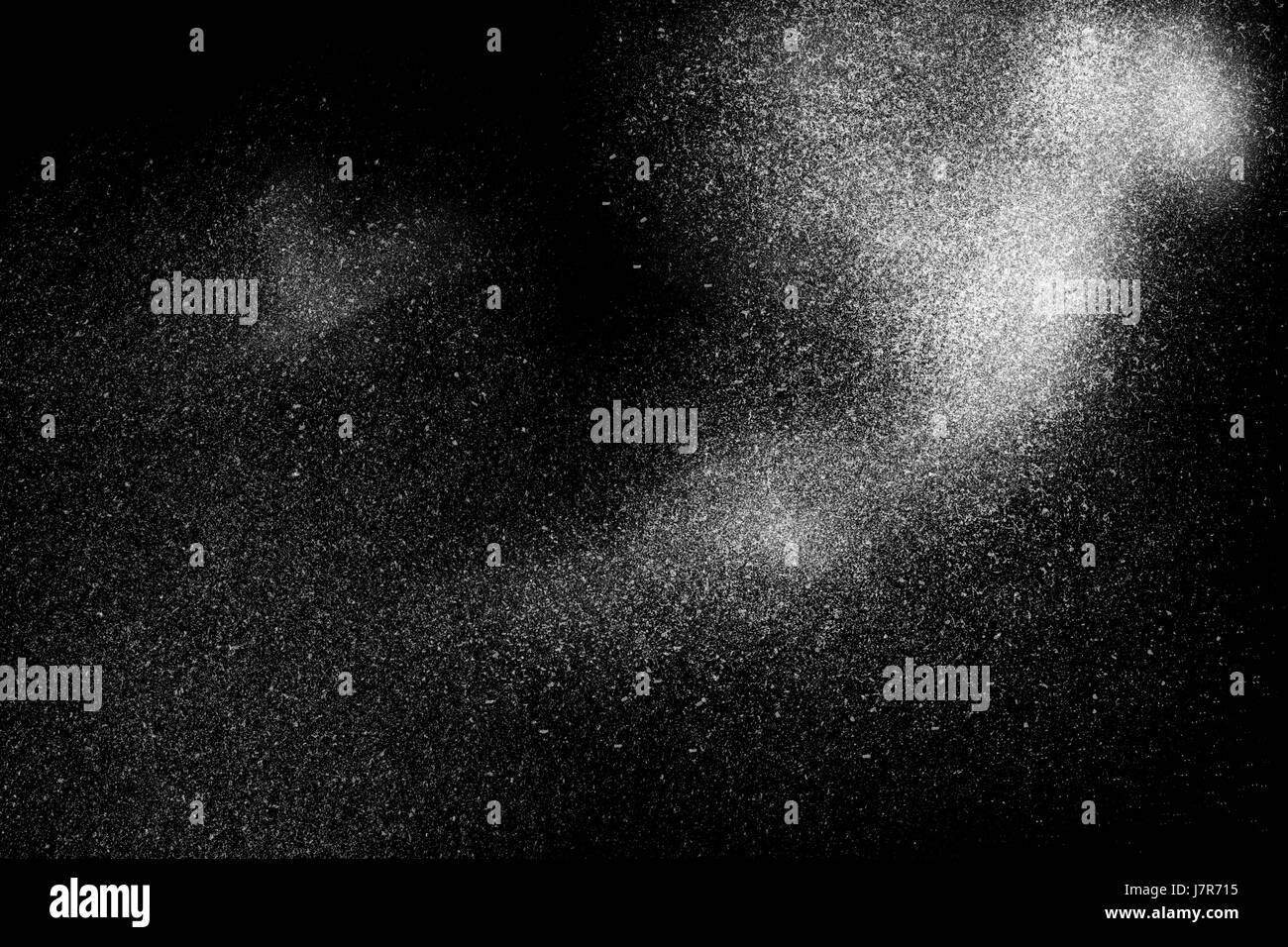 Abstract design of white powder cloud isolated on black, dark ...