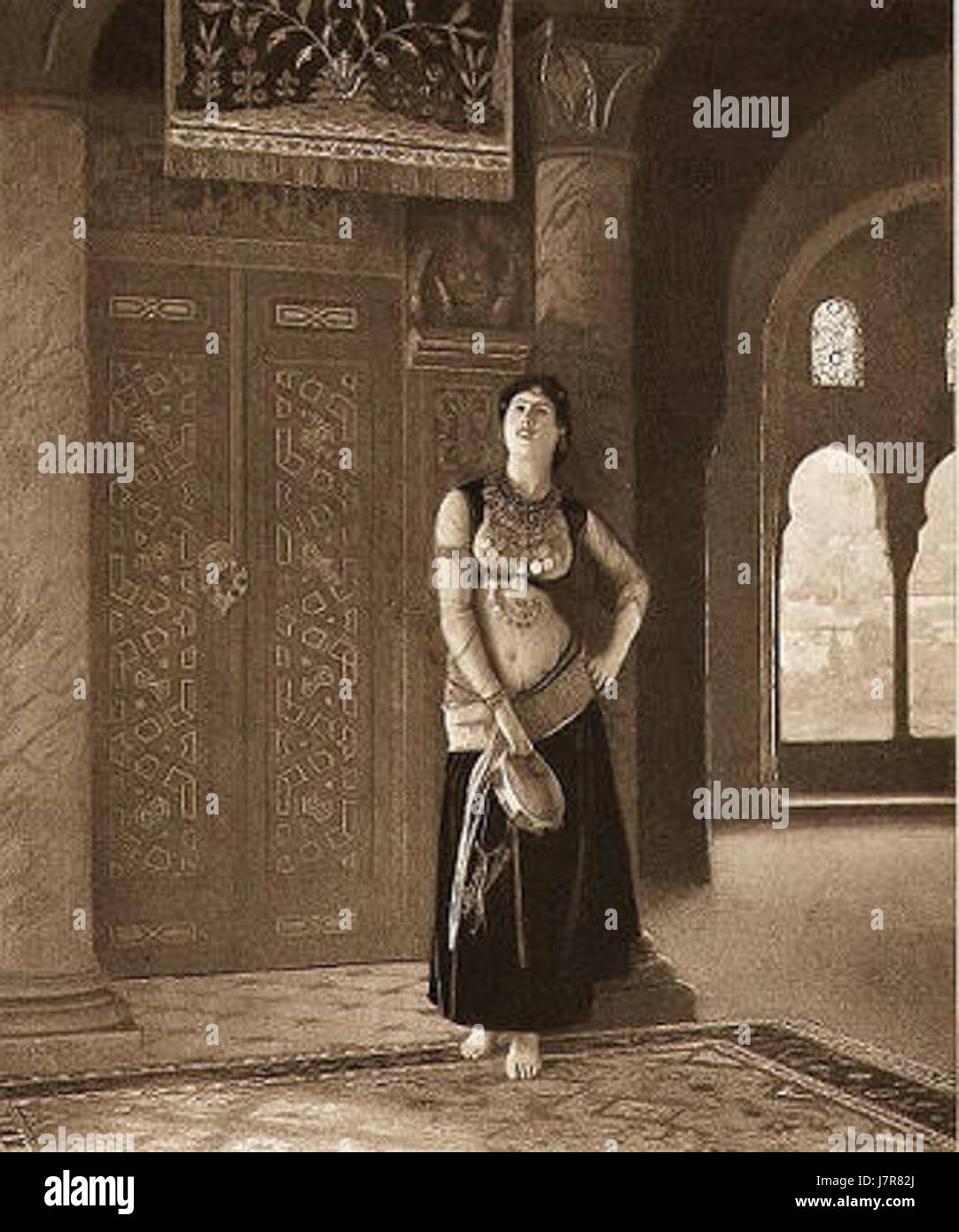 A dancer with a tambourine, likely captured in an artwork or ...