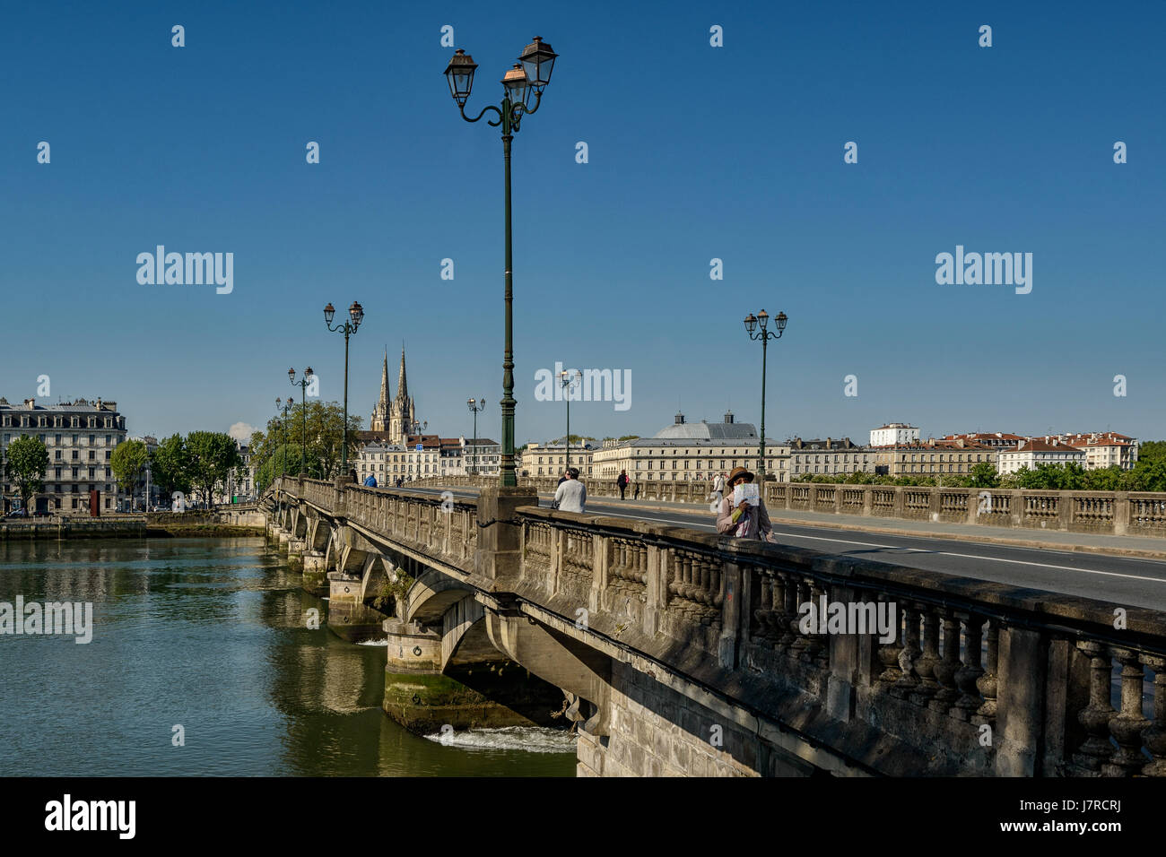 View of Saint Spirit Bridge over the Adour river and the cathedral in ...