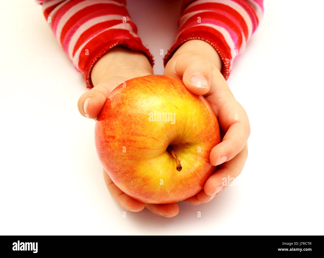 possession holding child apple fresh food aliment hand hands leaf ...