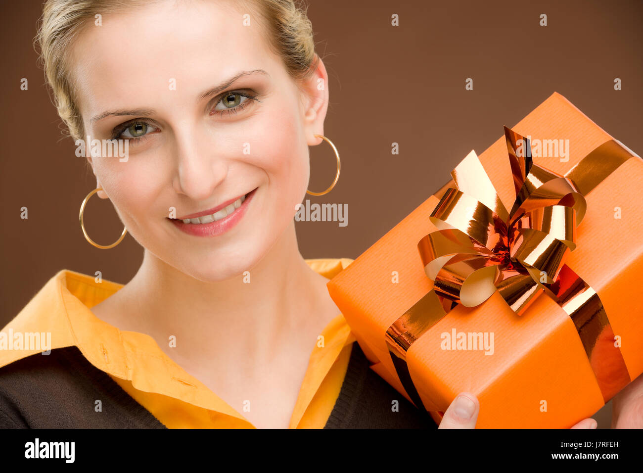 woman present party celebration hold delighted unambitious enthusiastic ...