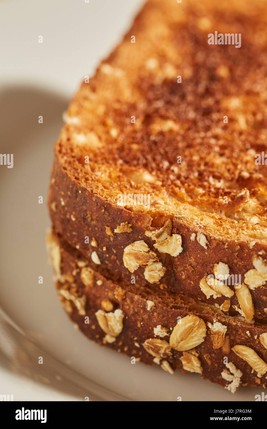 two slices of whole grain toast Stock Photo - Alamy