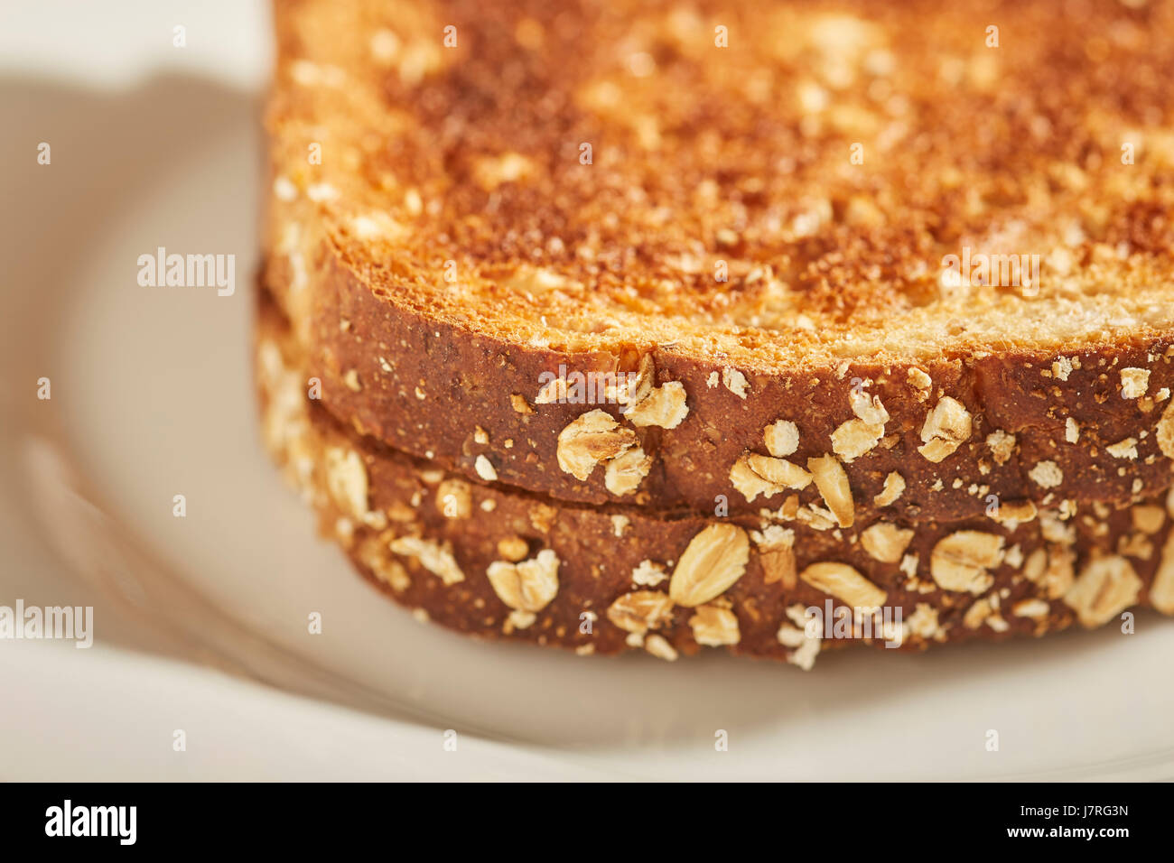 two slices of whole grain toast Stock Photo - Alamy